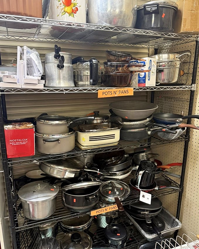 Pots and pans galore for aspiring chefs and practical cooks alike. Cast iron treasures hiding among aluminum basics.