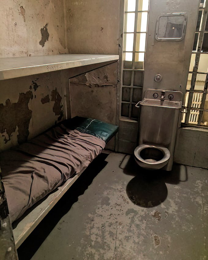 The ultimate in minimalist living—a metal slab for sleeping, institutional toilet, and not an inch of privacy. Hotel stars? Zero. Historical significance? Five.