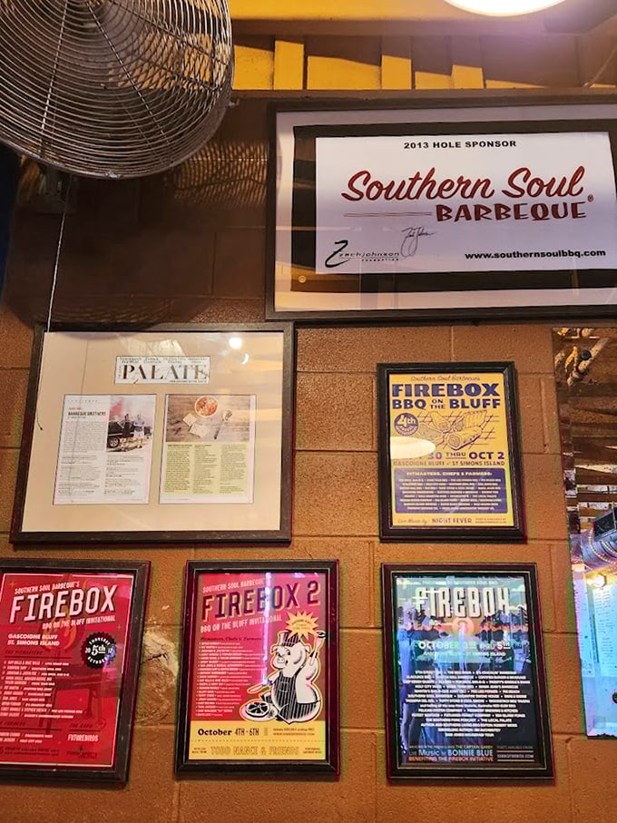 Wall of fame or wall of flame? The framed accolades and event posters show this isn't just good barbecue—it's barbecue with credentials.