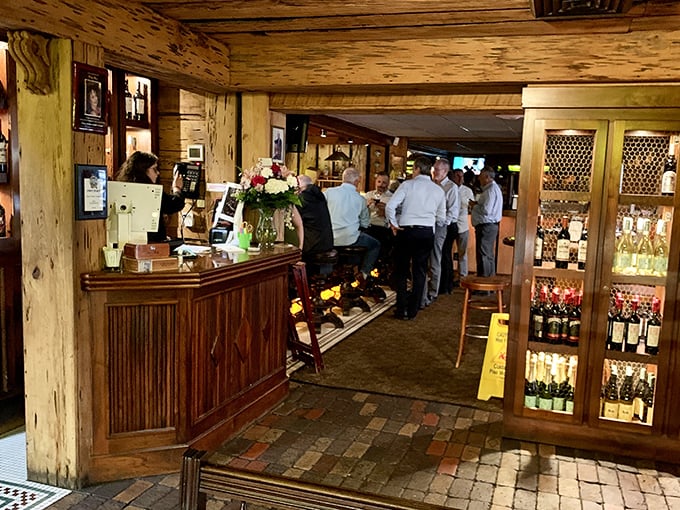 The entrance area buzzes with anticipation as diners wait for their table. Good things come to those who wait—great steaks come to those who reserve.