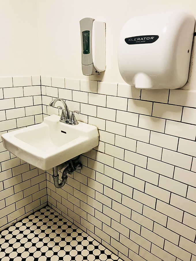 Even the restroom has that classic Philly vibe—practical, no-nonsense, and surprisingly photogenic with its vintage tile work.