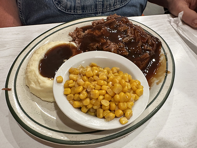 Beef that's clearly been simmering since sunrise, alongside creamy mashed potatoes and sweet corn – rural Missouri's answer to fine dining.