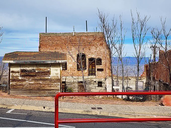 These weathered structures have survived copper busts, fires, and gravity itself – the architectural equivalent of "I'm not leaving and you can't make me."