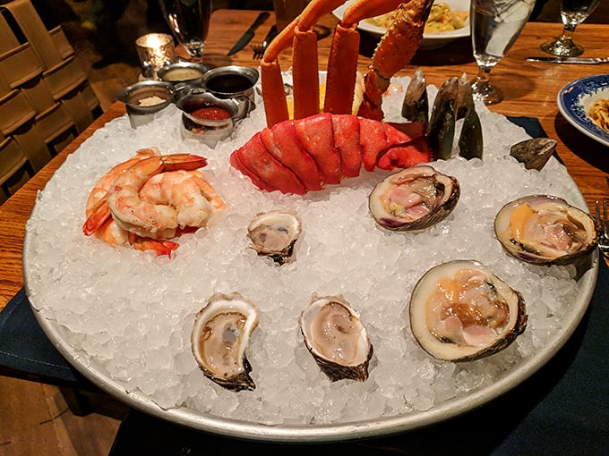 The seafood tower that makes landlocked diners forget they're miles from any ocean—a monument to freshness.