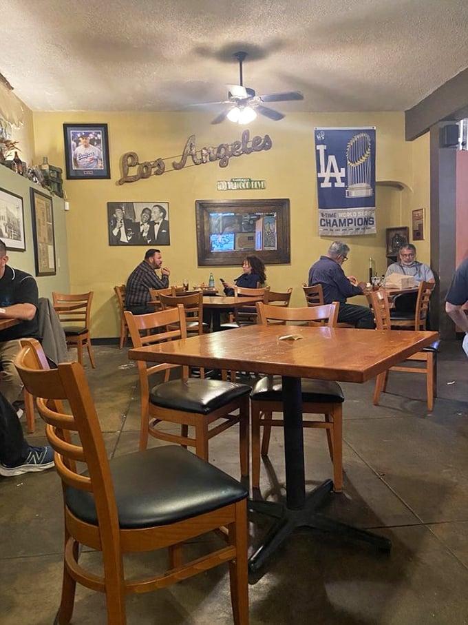 The dining area feels like Sunday at your Italian friend's house – Dodgers memorabilia, comfortable chairs, and the buzz of satisfied conversation.