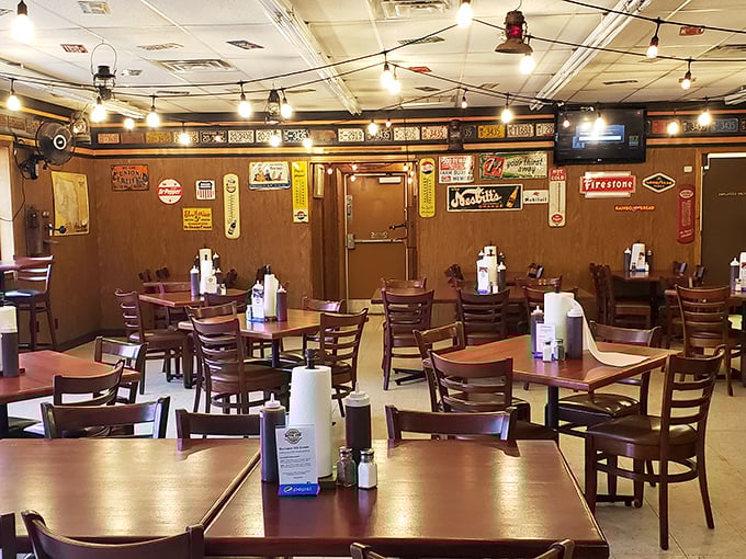 The dining room has that perfect "focus on the food" vibe. Those vintage signs aren't decoration—they're the previous generation's Yelp reviews.