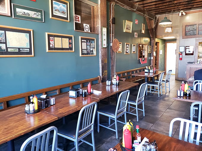 The dining room's teal walls adorned with railroad memorabilia create the perfect backdrop for morning conversations and coffee refills.