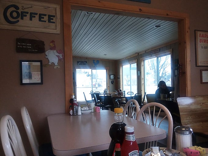 Sunlight streams through windows illuminating simple tables where farmers sit alongside office workers—breakfast democracy in its purest form.