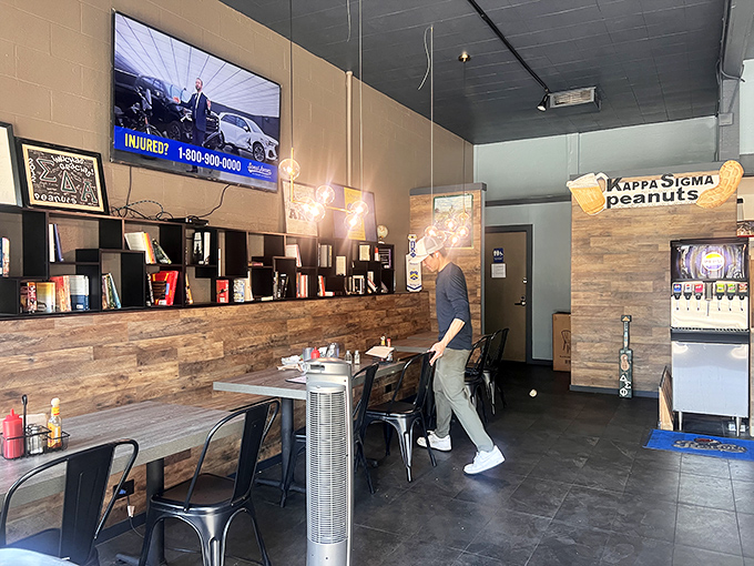 The modern cafe aesthetic meets classic diner functionality—where wood-paneled walls and metal chairs create the perfect backdrop for breakfast epiphanies.