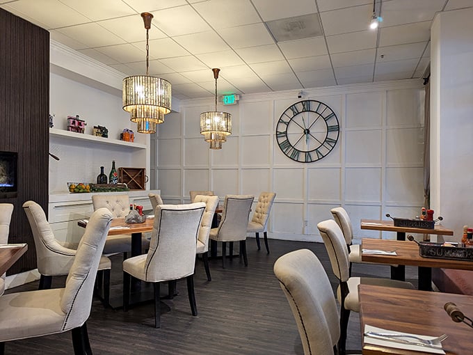 Elegant chandeliers and cream-colored chairs create a dining room that feels like your stylish friend's home—if your friend were a breakfast genius.