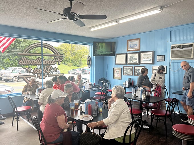 Sunlight streams through windows as diners gather at tables – this isn't just eating, it's the daily ritual of small-town connection.