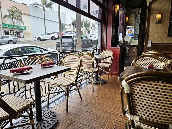 Bistro-style seating with woven chairs that whisper "stay awhile." This isn't just a meal—it's a Mediterranean-inspired California afternoon.