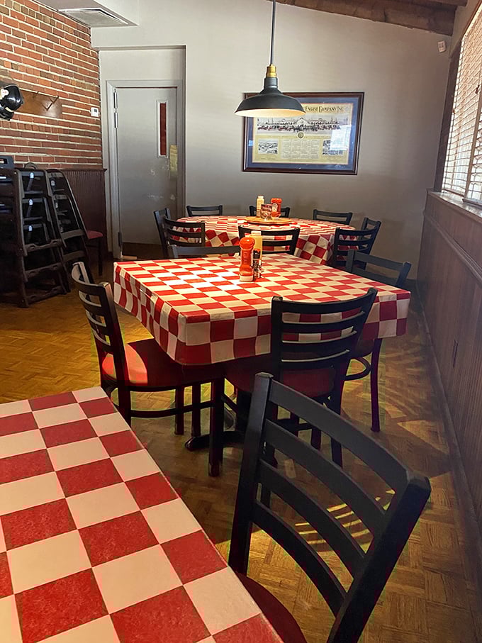Red and white checkered tablecloths aren't just decoration—they're fair warning that delicious messiness is about to ensue.