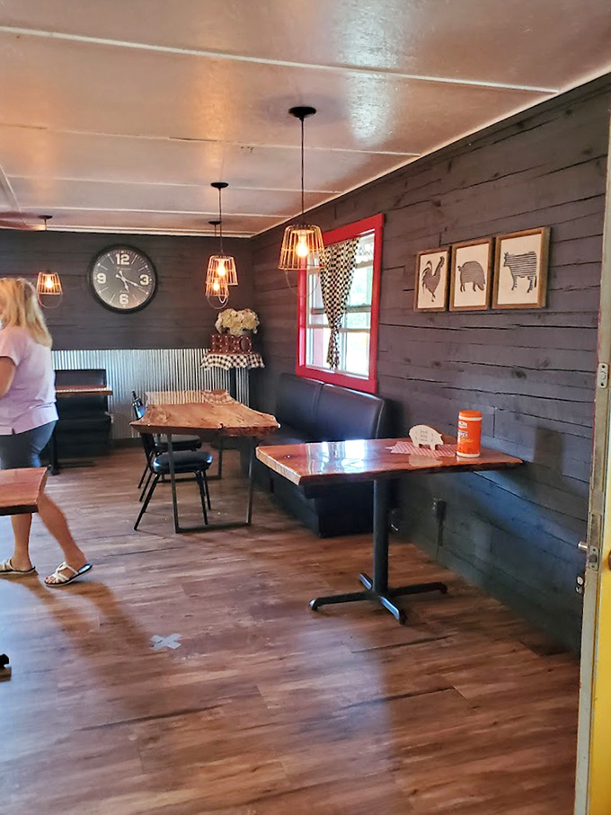 Rustic wooden tables beneath cage lights create the perfect stage for the real stars of the show – whatever smoked delights are about to grace your plate.