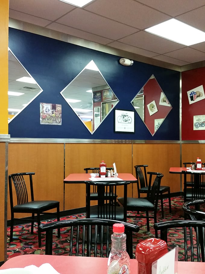 Diamond-shaped mirrors reflect a diner that knows exactly what it is. No identity crisis here, just breakfast confidence in every corner.