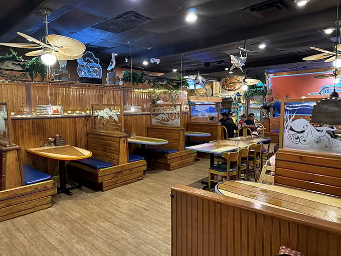 Wooden booths create cozy nooks for intimate conversations – or serious strategic planning for your seafood attack.