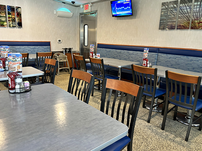 Tables arranged with mathematical precision, each one a stage where breakfast dramas and dinner comedies play out daily for Emmaus residents.