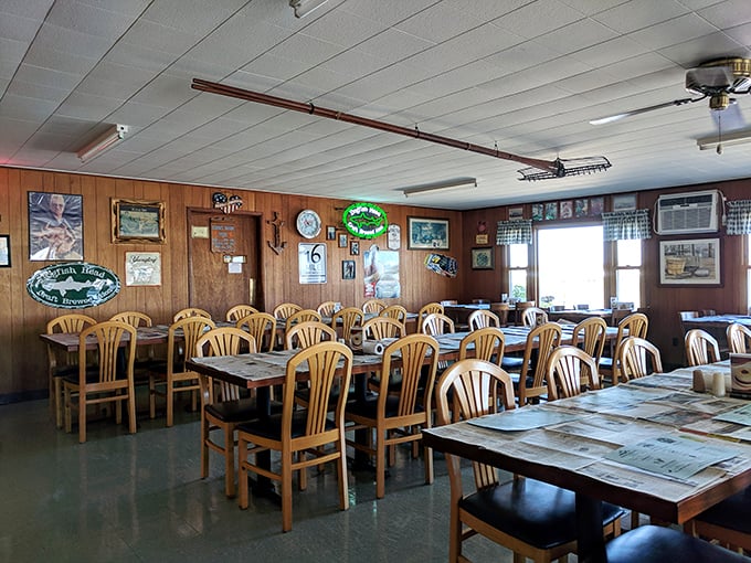 No white tablecloths here—just honest tables ready for the newspaper covering that signals serious seafood business is about to go down.