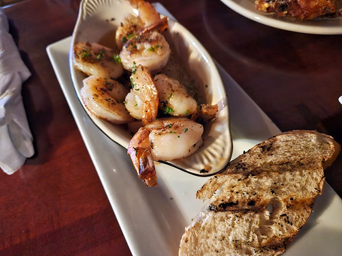 Plump, perfectly seared shrimp alongside crusty bread—proof that sometimes the simplest preparations let quality ingredients shine brightest.