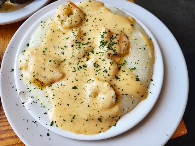Creamy shrimp and grits that would make any Charlestonian proud—comfort food elevated to an art form with fresh herbs as the finishing touch.