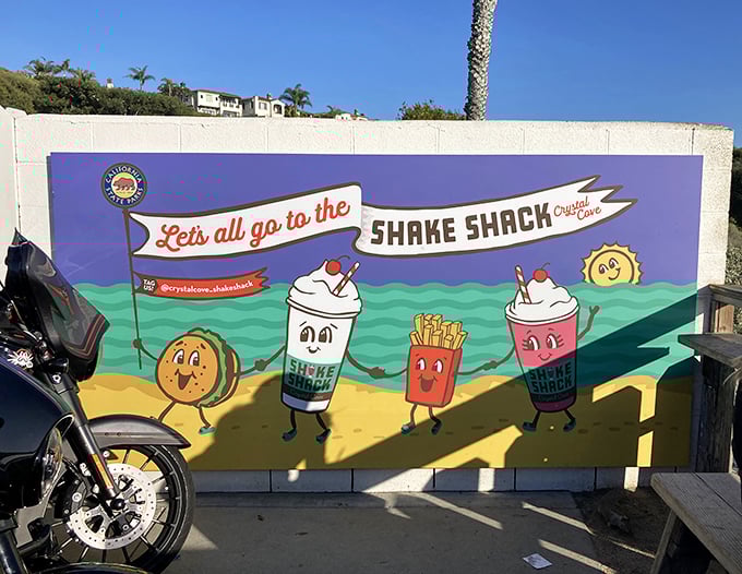 This mural doesn't just advertise—it captures the spirit of Crystal Cove's beachside joy. Those cartoon milkshakes are living their best lives.
