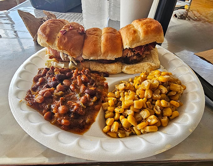 These aren't your average sliders – they're barbecue diplomats on a plate, bringing together pulled pork, baked beans and corn in perfect harmony.
