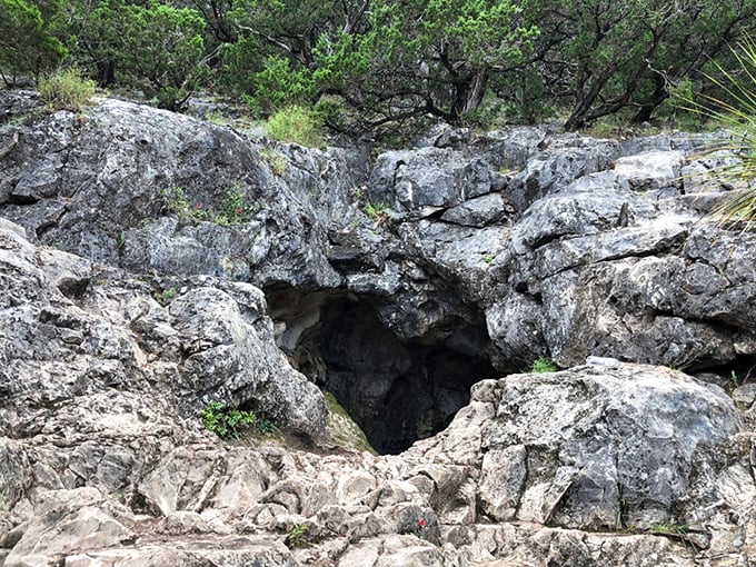 This limestone cave entrance whispers of ancient secrets and possibly serves as central Texas's most natural air conditioning system.