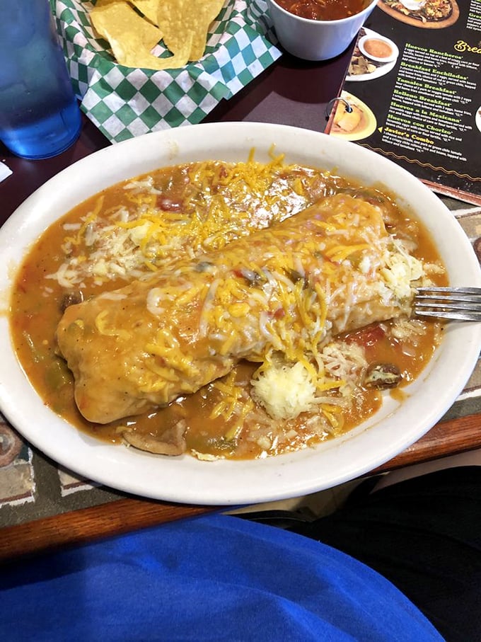 This smothered burrito isn't just food—it's an edible security blanket, covered in cheese and wrapped in pure comfort.