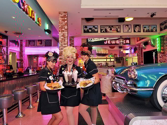 The waitstaff doesn't just serve food—they serve an experience, complete with hairstyles that defy both gravity and the passage of time.