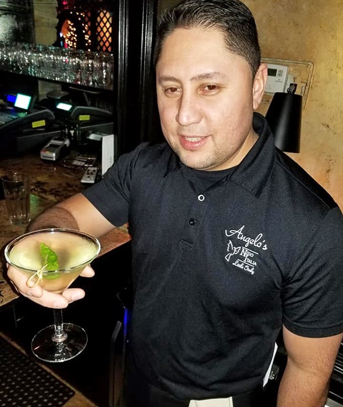 Behind every perfect cocktail is a skilled bartender, crafting libations with the precision and care that defines the Angelo's experience.