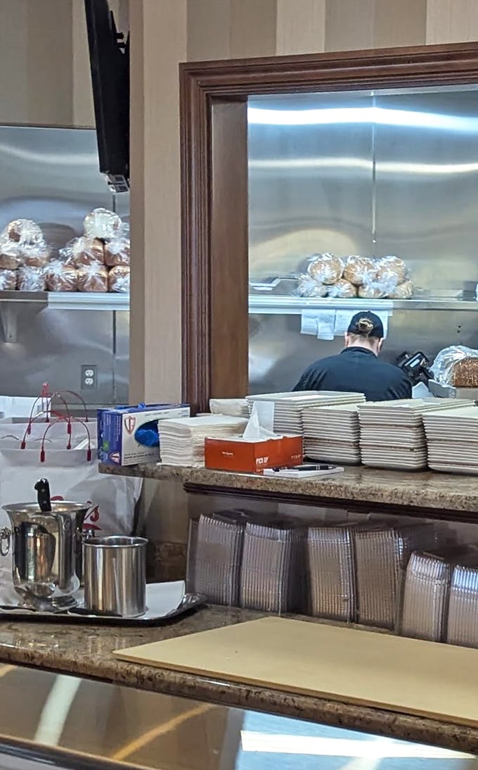 The kitchen pass offers a glimpse into the organized chaos where your deli dreams are carefully assembled and plated to perfection.