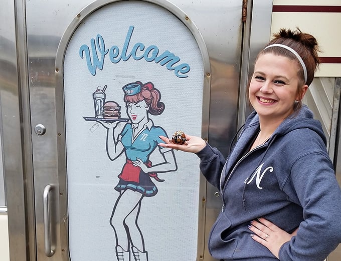 The welcome sign featuring a classic diner waitress sets the tone—this place serves nostalgia alongside its famous pies and burgers.
