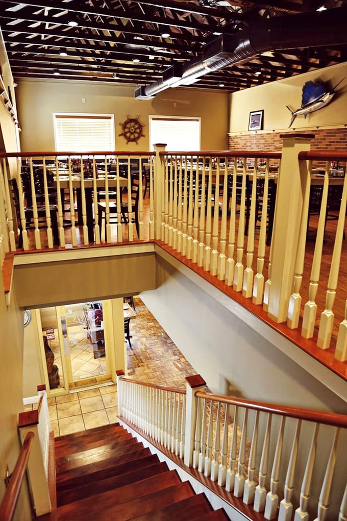 The staircase reveals Feby's surprising spaciousness—like finding an extra room in your house you never knew existed, but filled with seafood.