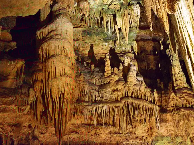 Nature's chandeliers hang from cathedral ceilings of stone. These delicate formations took millennia to create—each drip of mineral-rich water adding another microscopic layer.