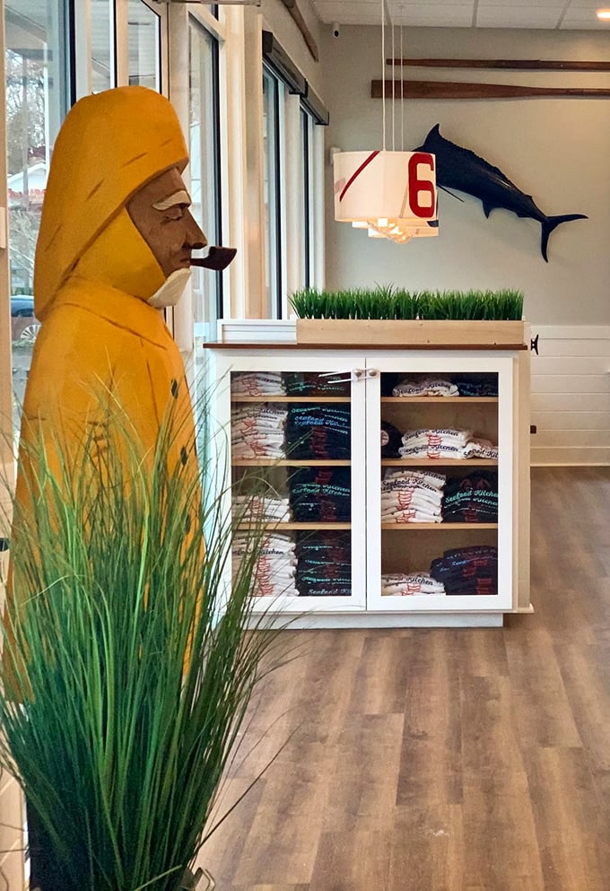 Even the merchandise corner features a fisherman statue standing guard over SoDel Concepts gear. He's seen things at sea you wouldn't believe—and the kitchen has the recipes.