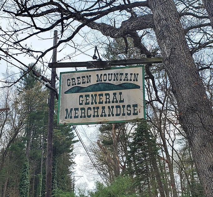 The vintage sign hanging among the trees announces you've found the place. Like a treasure map's X marking the spot.