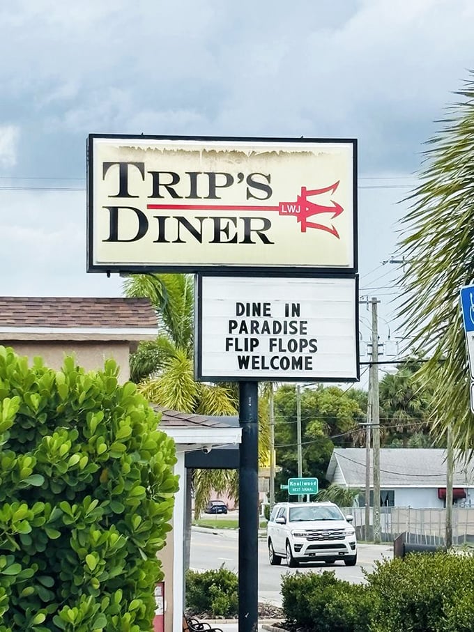 "Dine in Paradise, Flip Flops Welcome"—the most Florida sign ever. When palm trees frame your diner sign, you know you're in the right place.