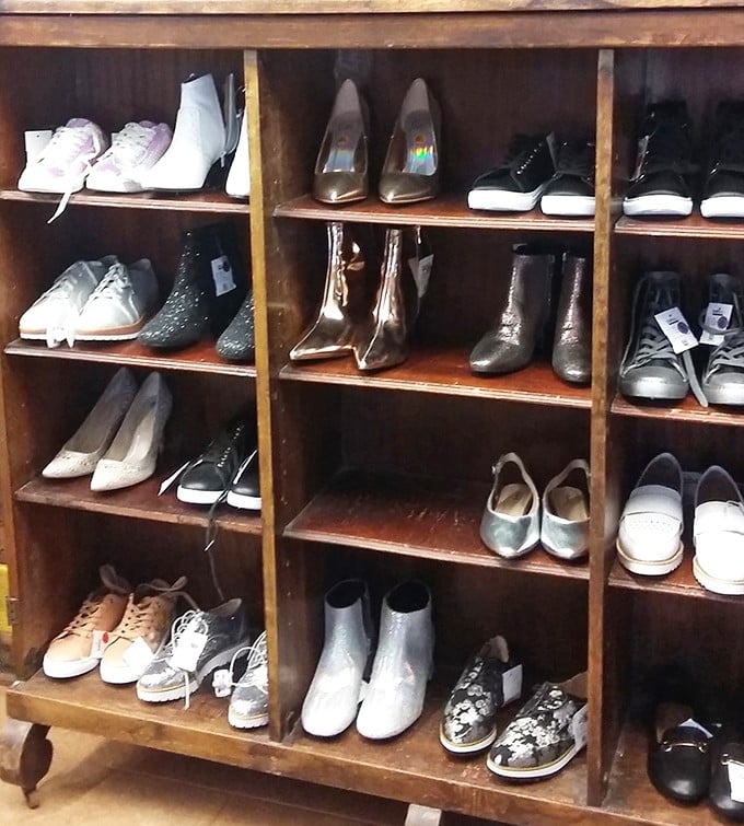 Shoe shelves organized with the precision of a library, where footwear finds its perfect match in an eager shopper.