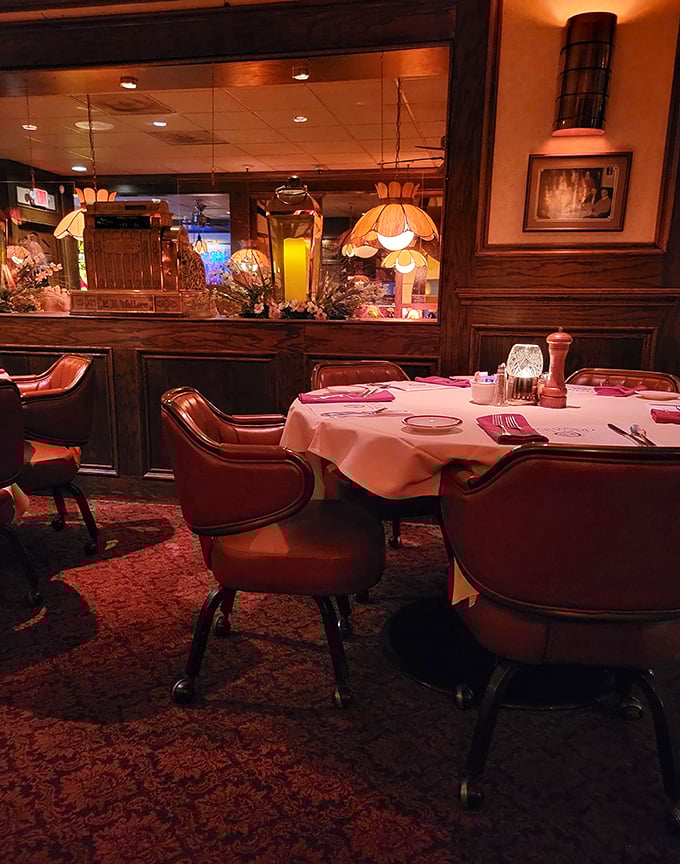 A table set for culinary adventure—white linens, proper silverware, and comfortable chairs that invite you to linger over that last bite.