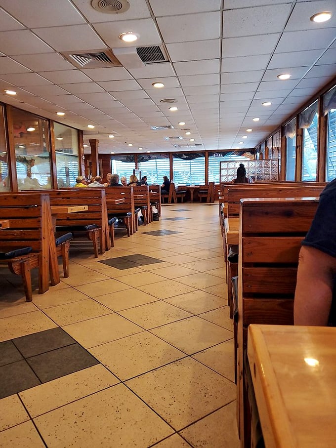 Wooden booths and clean sightlines – the restaurant equivalent of a well-designed boat where every seat has a good view.