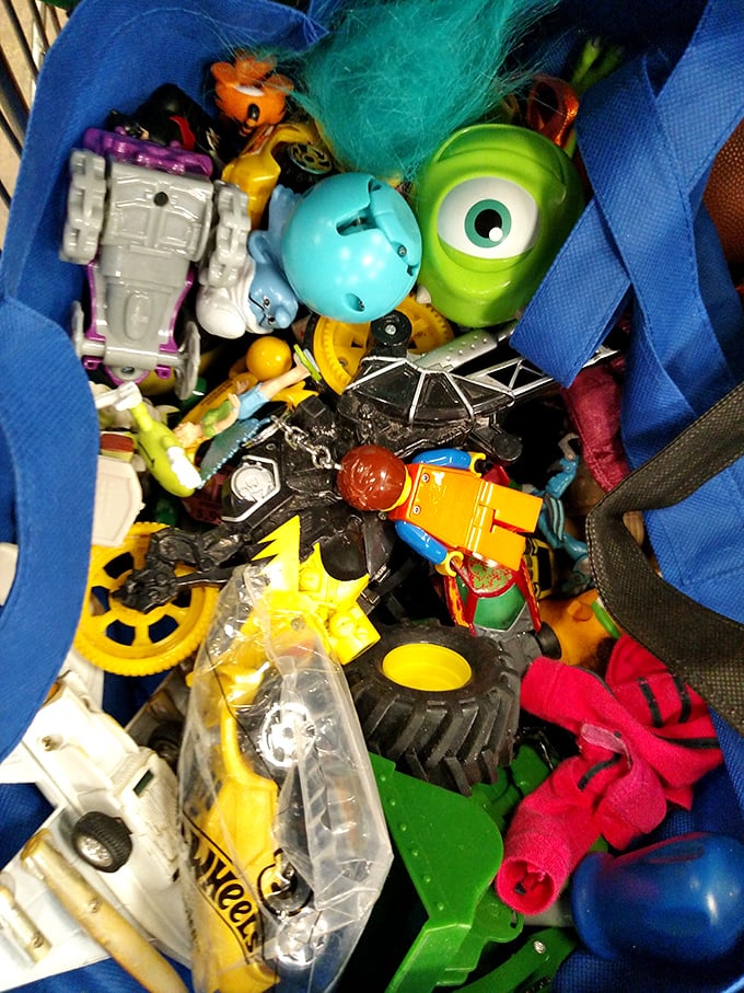 Toy bin archaeology reveals pop culture layers—from Mike Wazowski to Transformers—where nostalgic adults often get more excited than the kids.