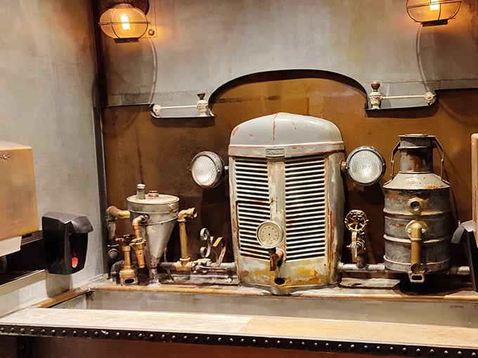 Even the hand-washing station embraces vintage charm with antique tractor parts – attention to atmospheric details throughout.