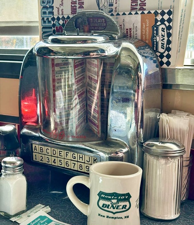 That tabletop jukebox isn't just playing songs—it's a time portal to when three songs for a quarter was the best entertainment value in town.