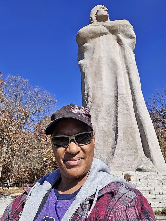 The statue's imposing presence provides perfect perspective—we humans are just temporary visitors in this ancient landscape.