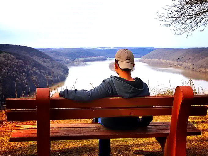 Solo contemplation meets spectacular scenery, where peaceful moments on wooden benches restore souls and inspire Instagram envy.