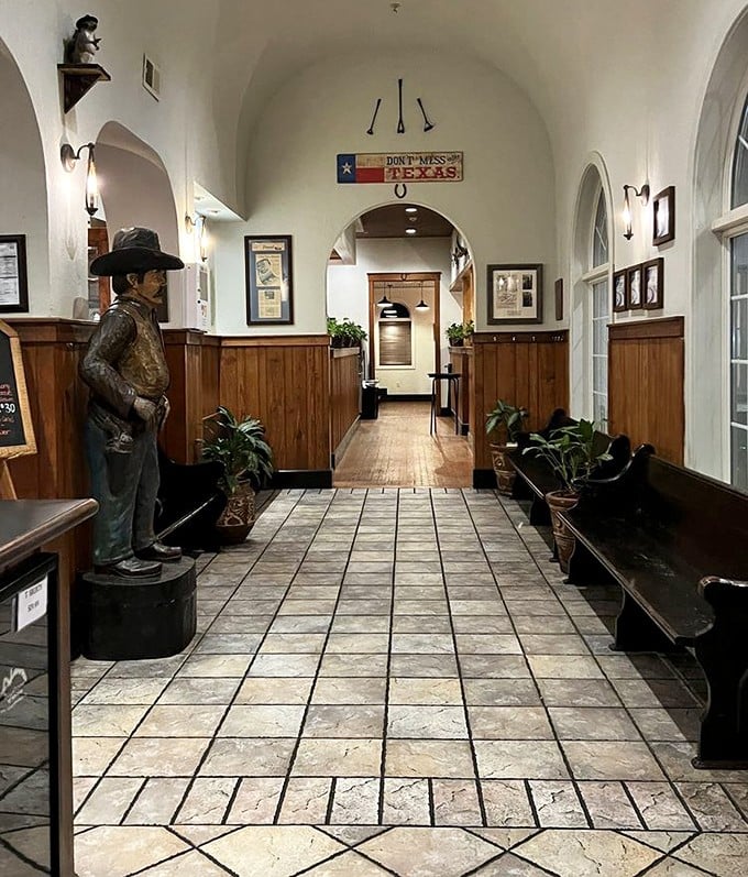 The hallway's Western charm sets the stage for what's to come – notice the "Don't Mess with Texas" sign, solid advice for both states and steaks.