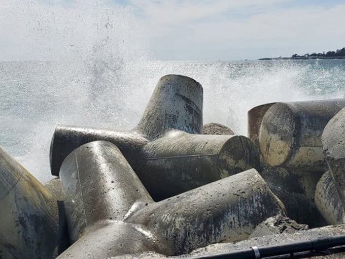 When winter storms arrive, these massive concrete tetrapods transform from odd sculptures into essential guardians, absorbing the ocean's fury.