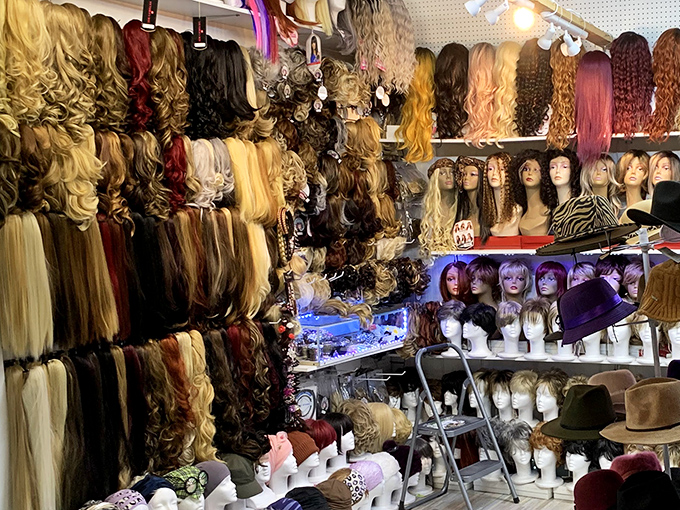 The wig and hat section—where you can literally try on new identities before committing to that antique credenza.