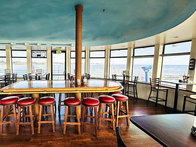 Floor-to-ceiling windows framing the Pacific – nature's own IMAX screen, no ticket required.