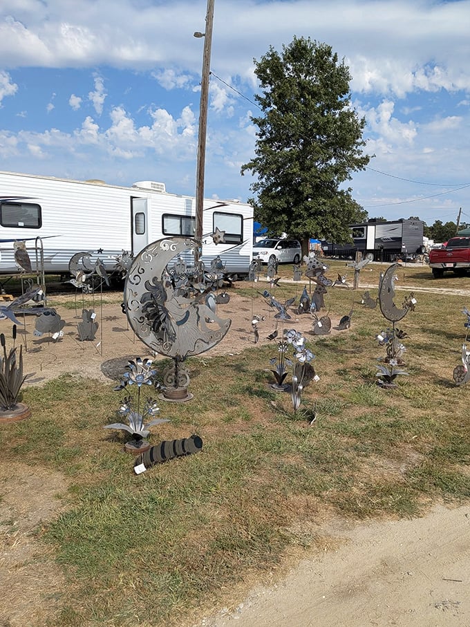 Metal moons and flowers create a galaxy of yard art. These shimmering sculptures catch sunlight by day and become mysterious silhouettes after dark.